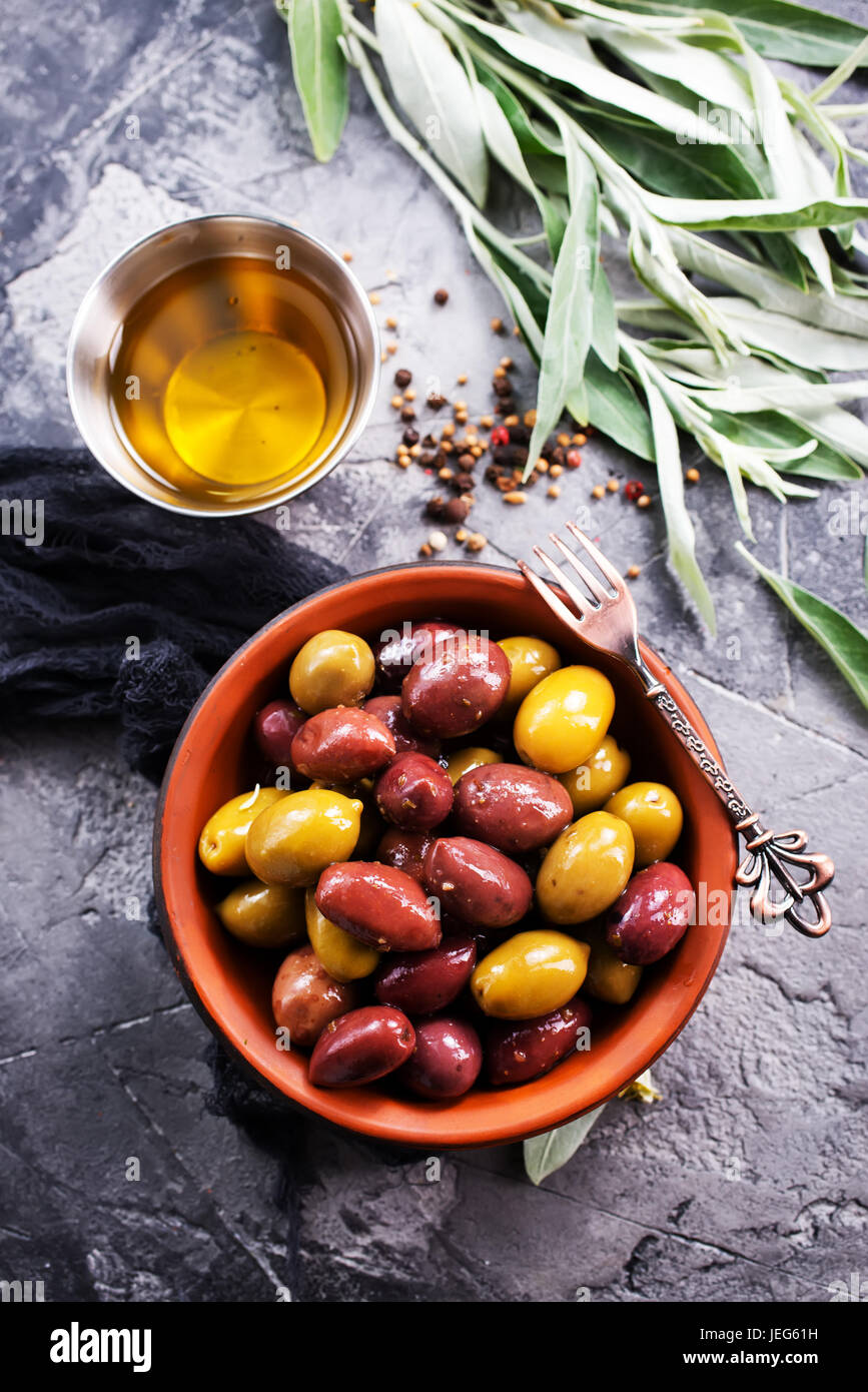 olives in bowl and on a table Stock Photo - Alamy