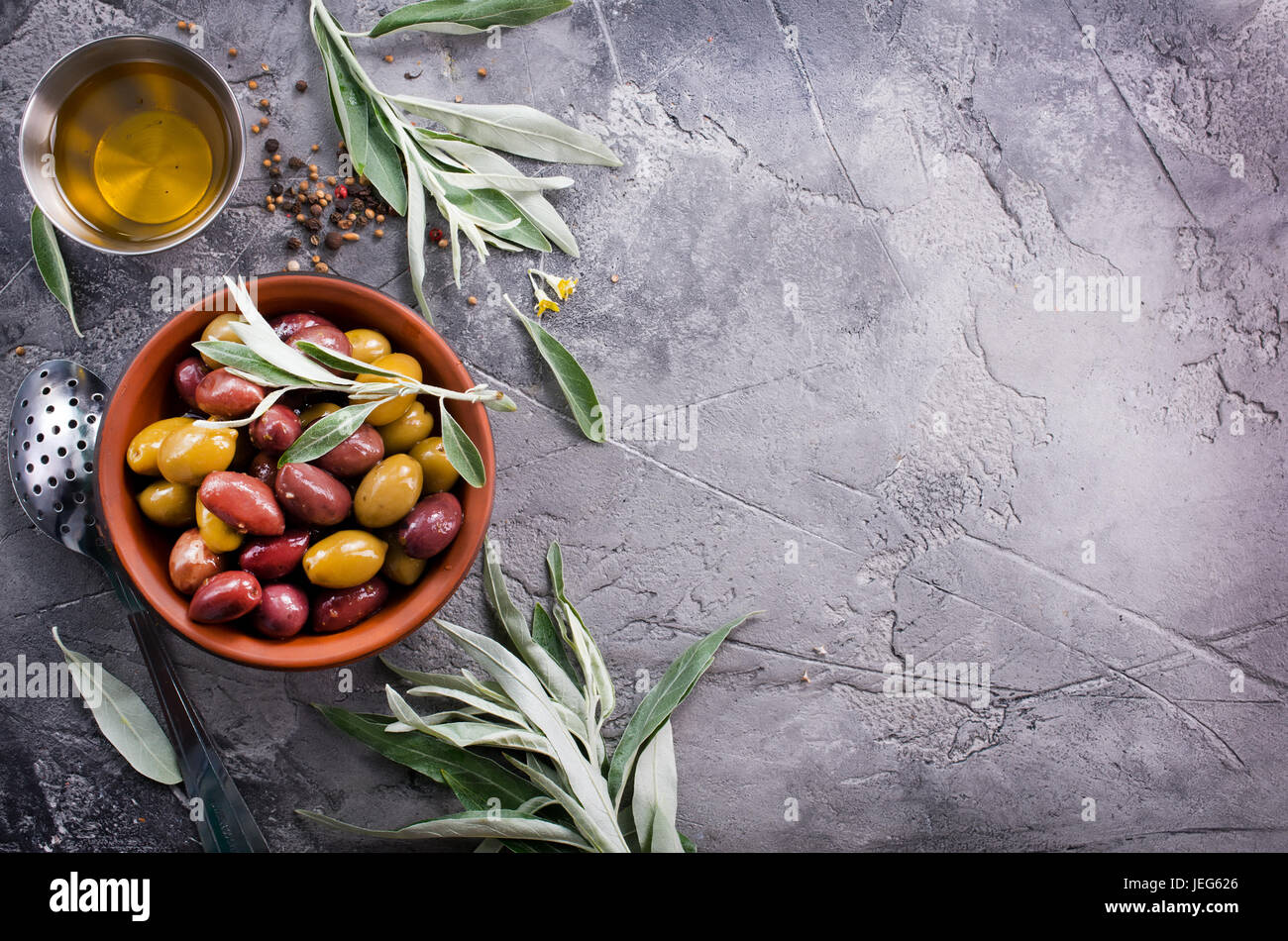 olives in bowl and on a table Stock Photo - Alamy