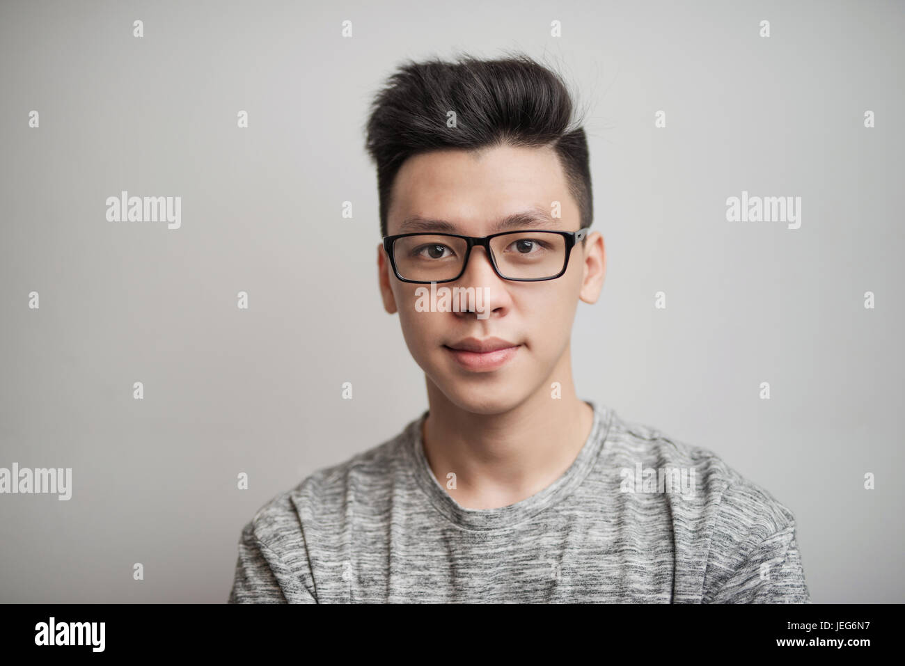 Portrait of good looking asian man in glasses Stock Photo - Alamy