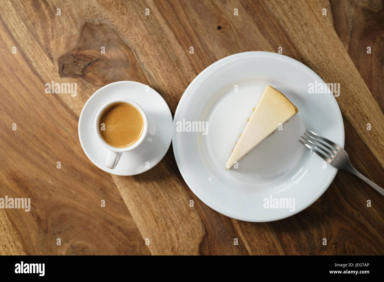 fresh espresso and cheesecake on table from above, simple style photo ...