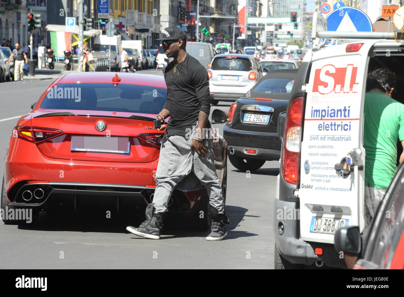 Mario Balotelli out shopping at the Puma store in Milan with his ...