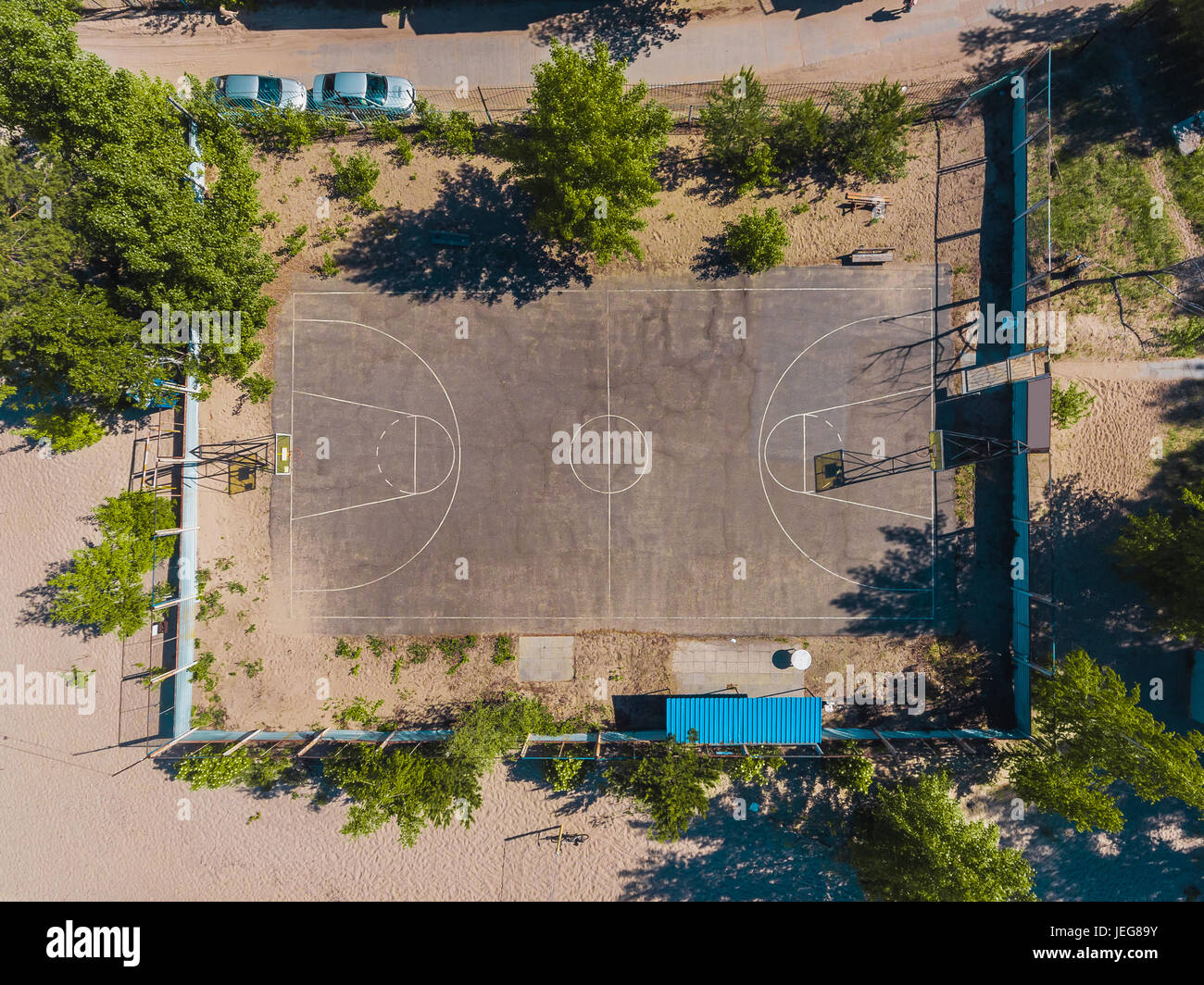 Aerial view basketball field on day time on the beach. Above with drone ...