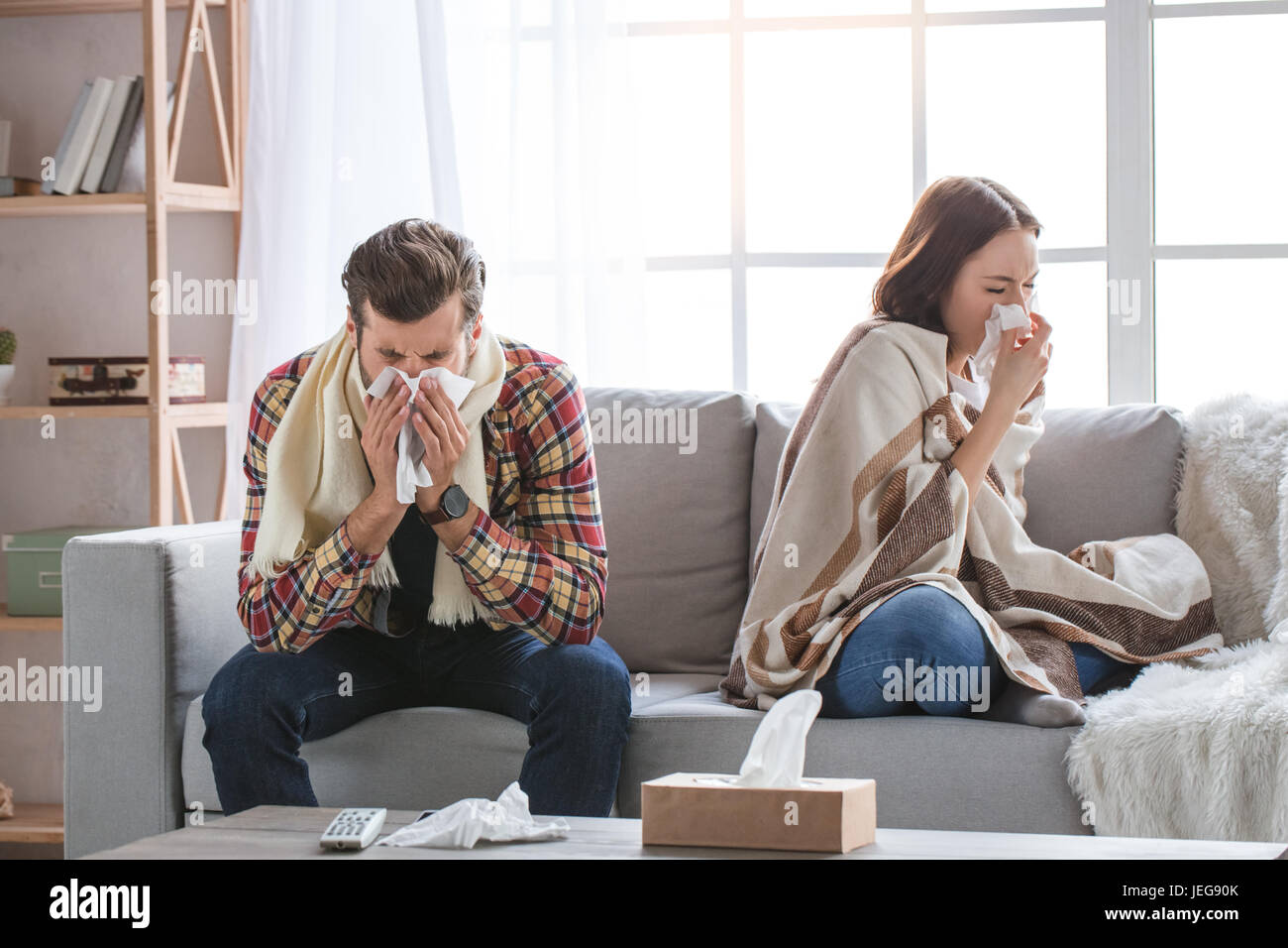 Young woman and man family couple indoors sick Stock Photo - Alamy