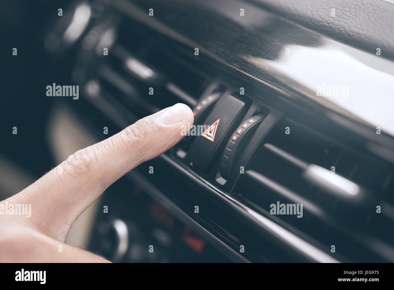 Young business person test drive new vehicle push button Stock Photo ...