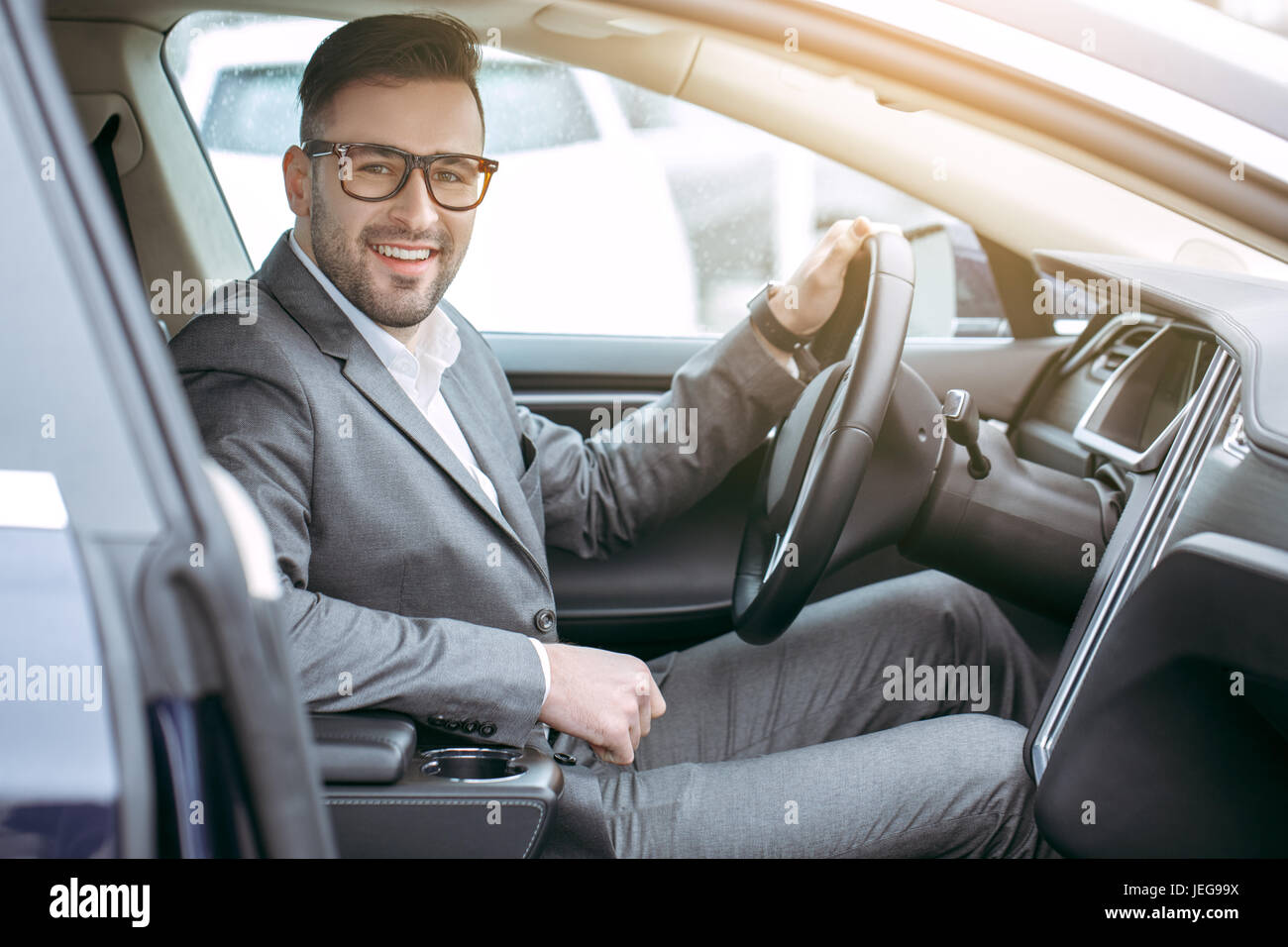 Man transportation by modern eco car smiling Stock Photo - Alamy