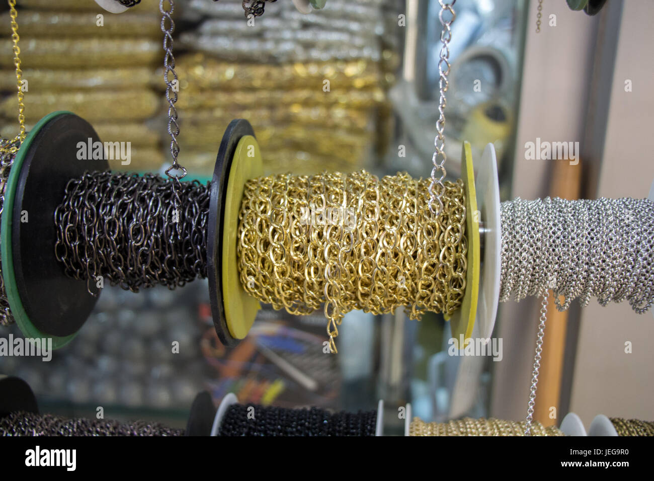 Rolls of decorative chains in view Stock Photo - Alamy