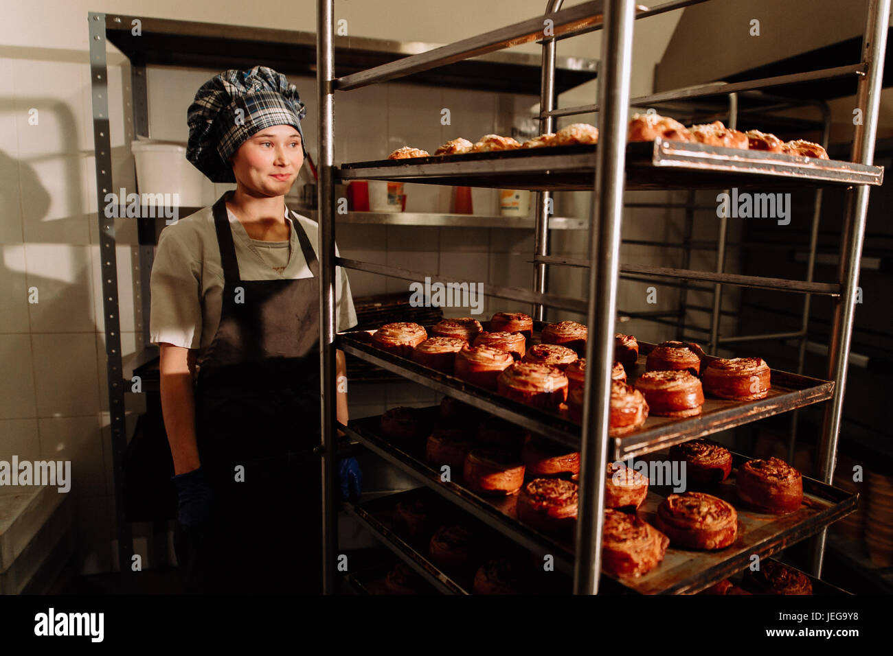 Female baker rolls dough hi-res stock photography and images - Alamy