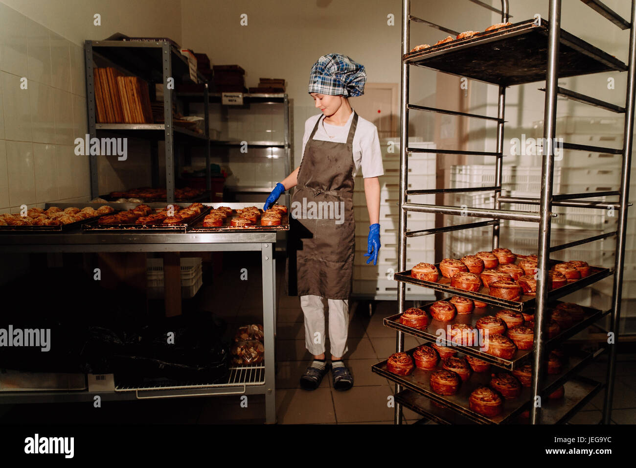 Female baker rolls dough hi-res stock photography and images - Alamy