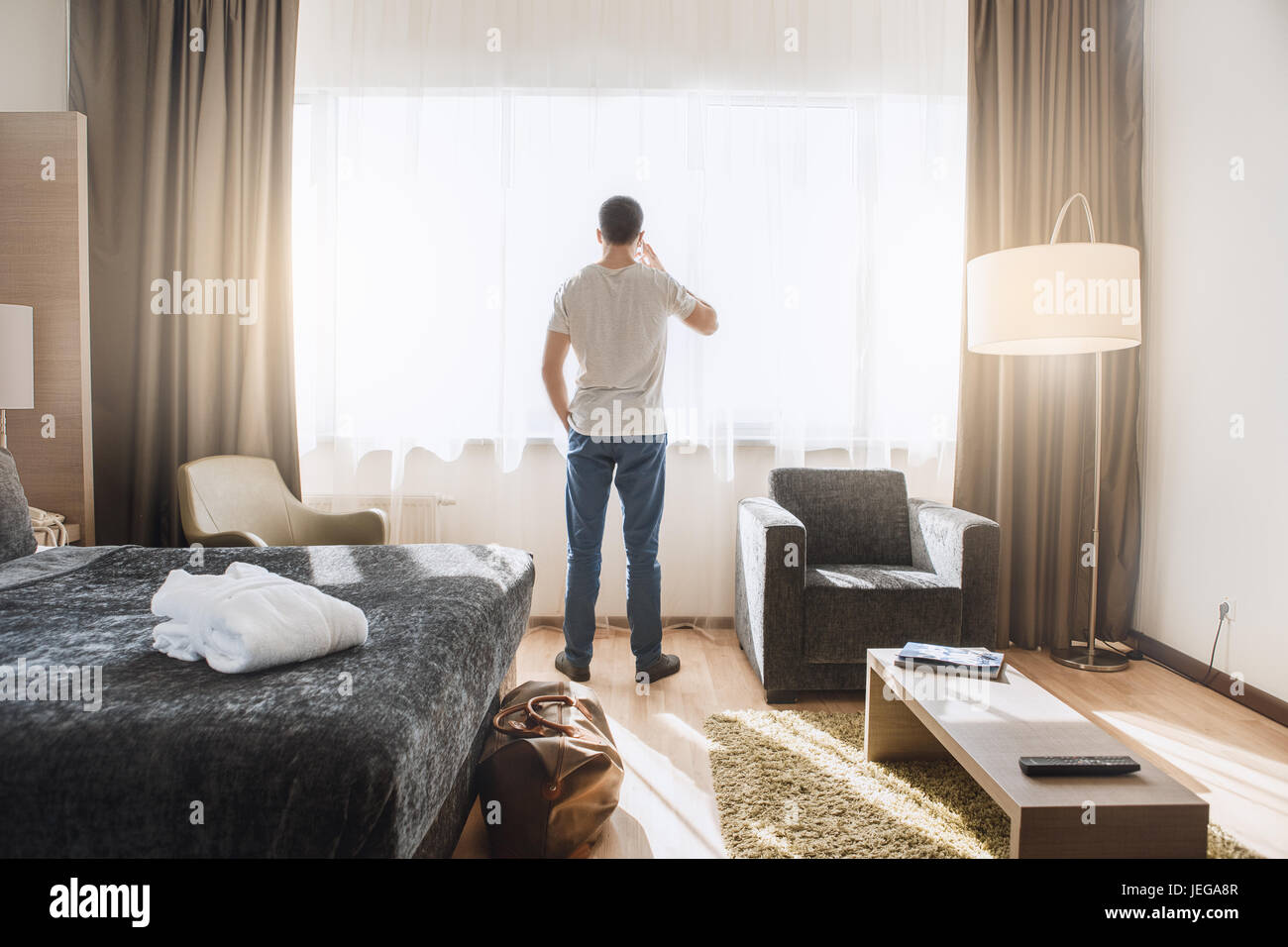 Young male traveler tourist hotel accomodation arrival Stock Photo - Alamy