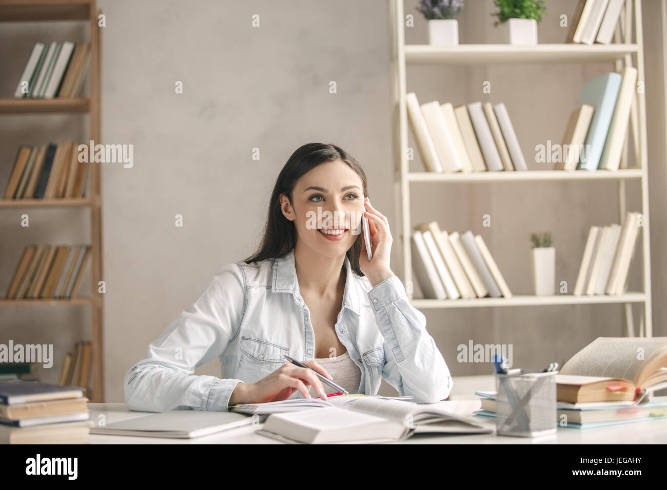 Young woman study at home alone using digital device Stock Photo - Alamy
