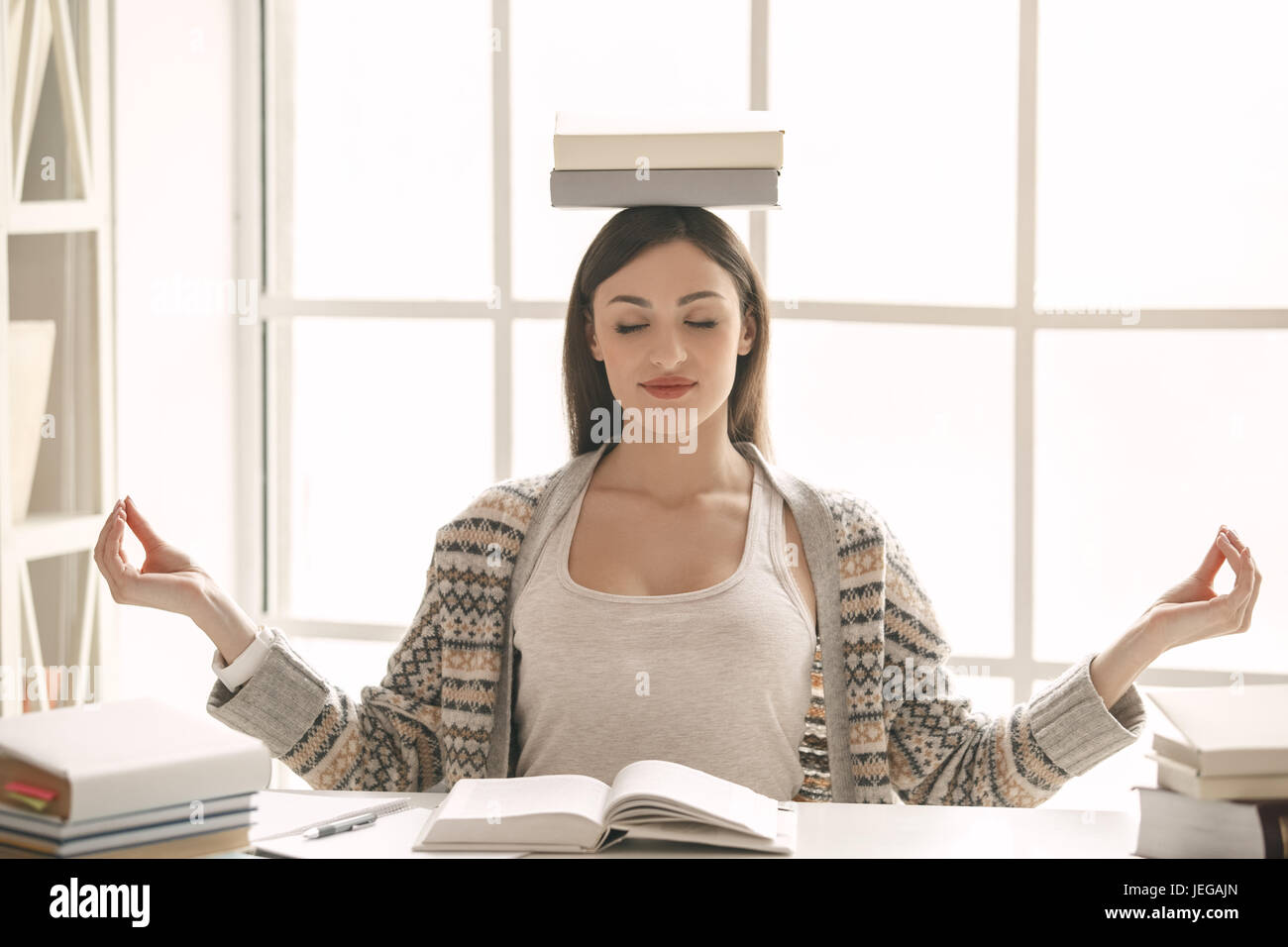 Young woman study at home alone meditation Stock Photo - Alamy