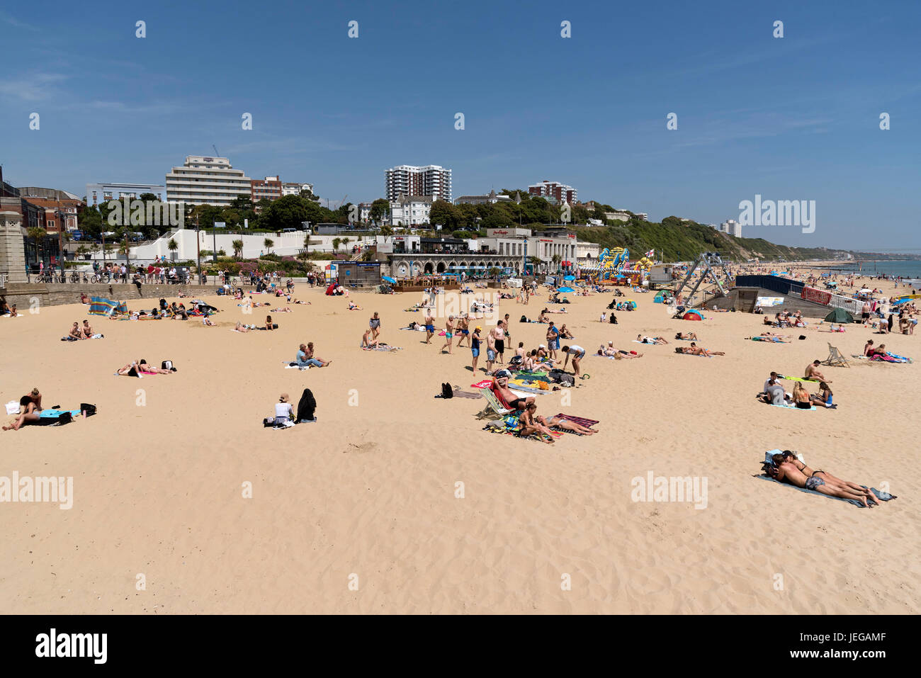 Holidaymakers on the beach at Bournemouth a popular seaside resort in ...
