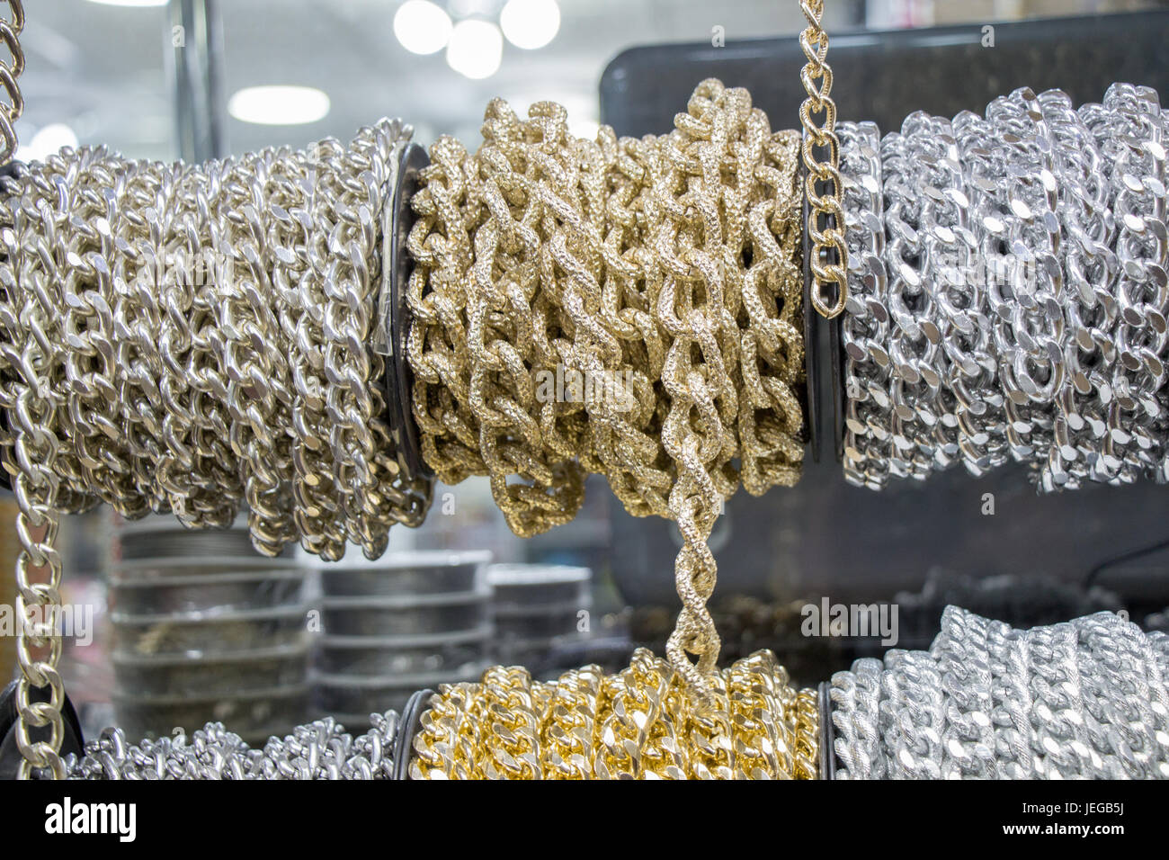 Rolls of decorative chains in view Stock Photo - Alamy