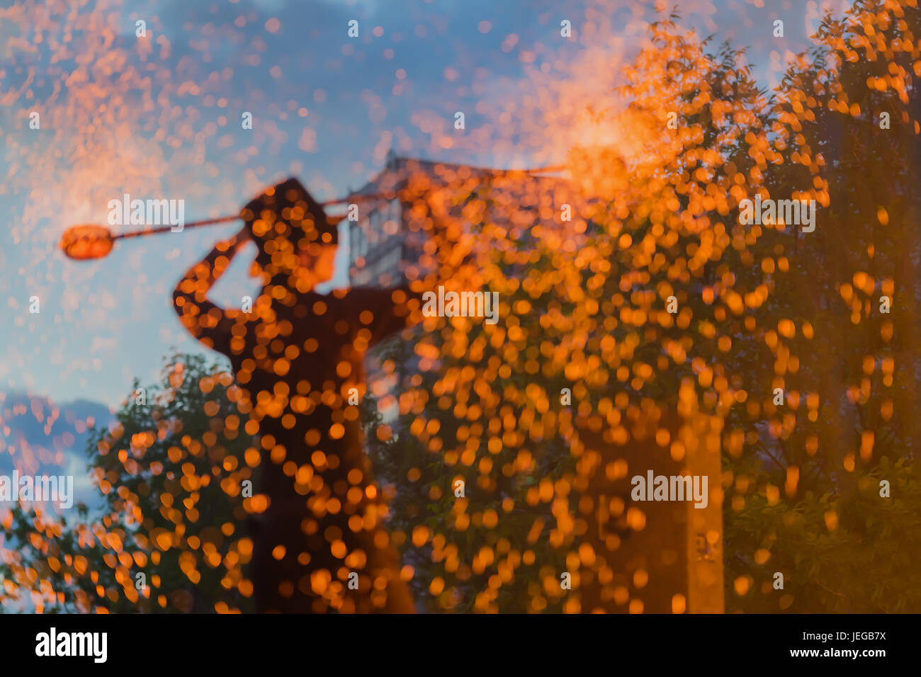 Dance of fire, performance. Dance of fire. Silhouette of man with a lot ...