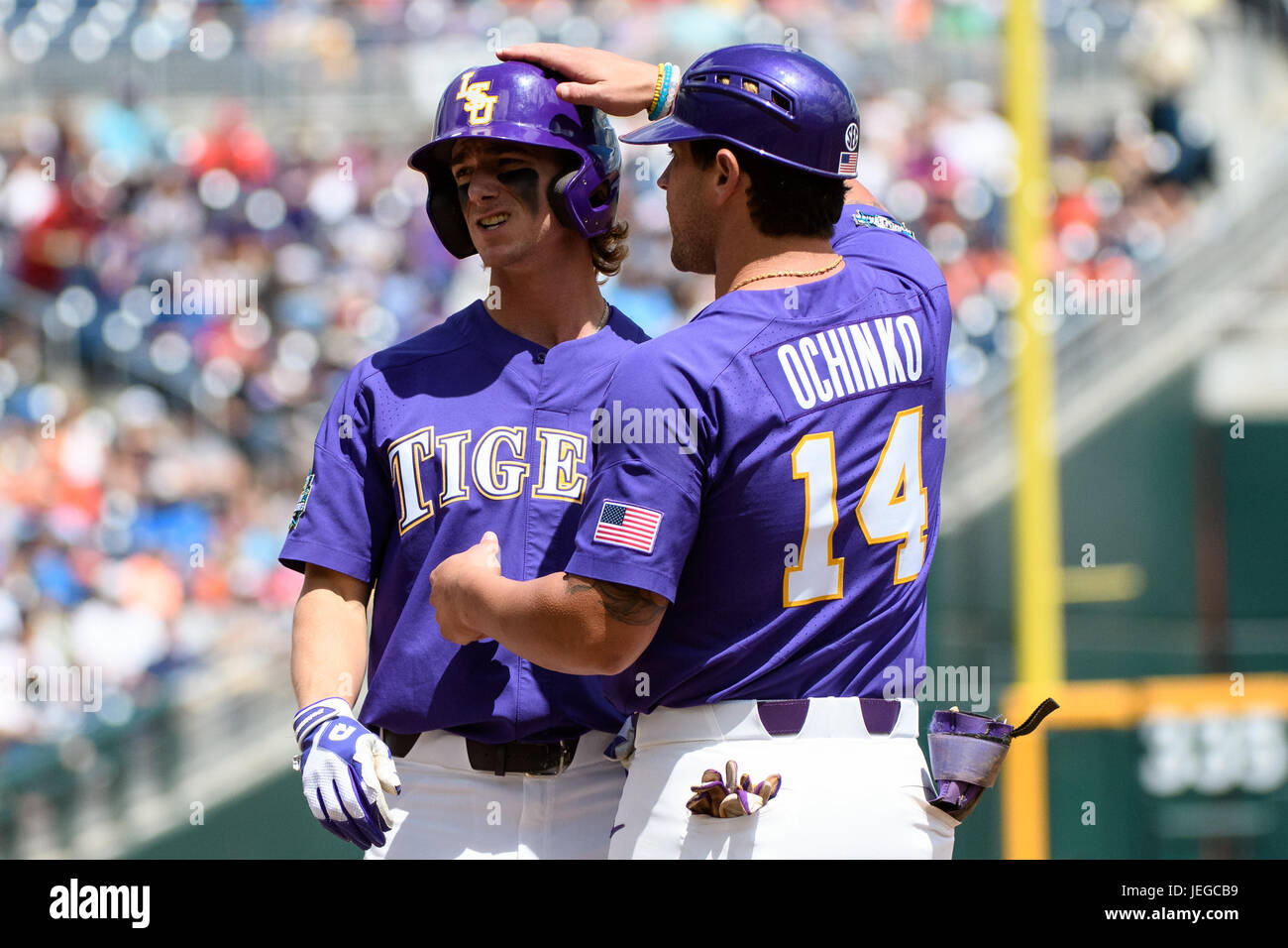 Omaha, NE USA. 23rd June, 2017. LSU's Zach Watson #9 gets a pat on the ...