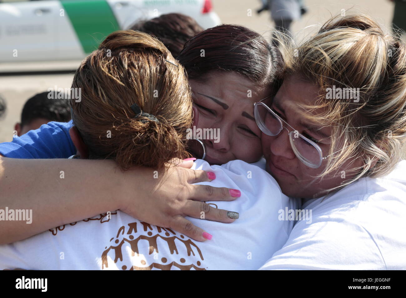 Juarez, Mexico. 24th June, 2017. Members of a family hug each other ...