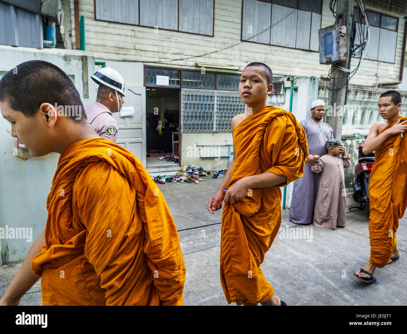 Bangkok, Thailand. 25th Jun, 2017. Buddhist monks walk past Ton Son ...