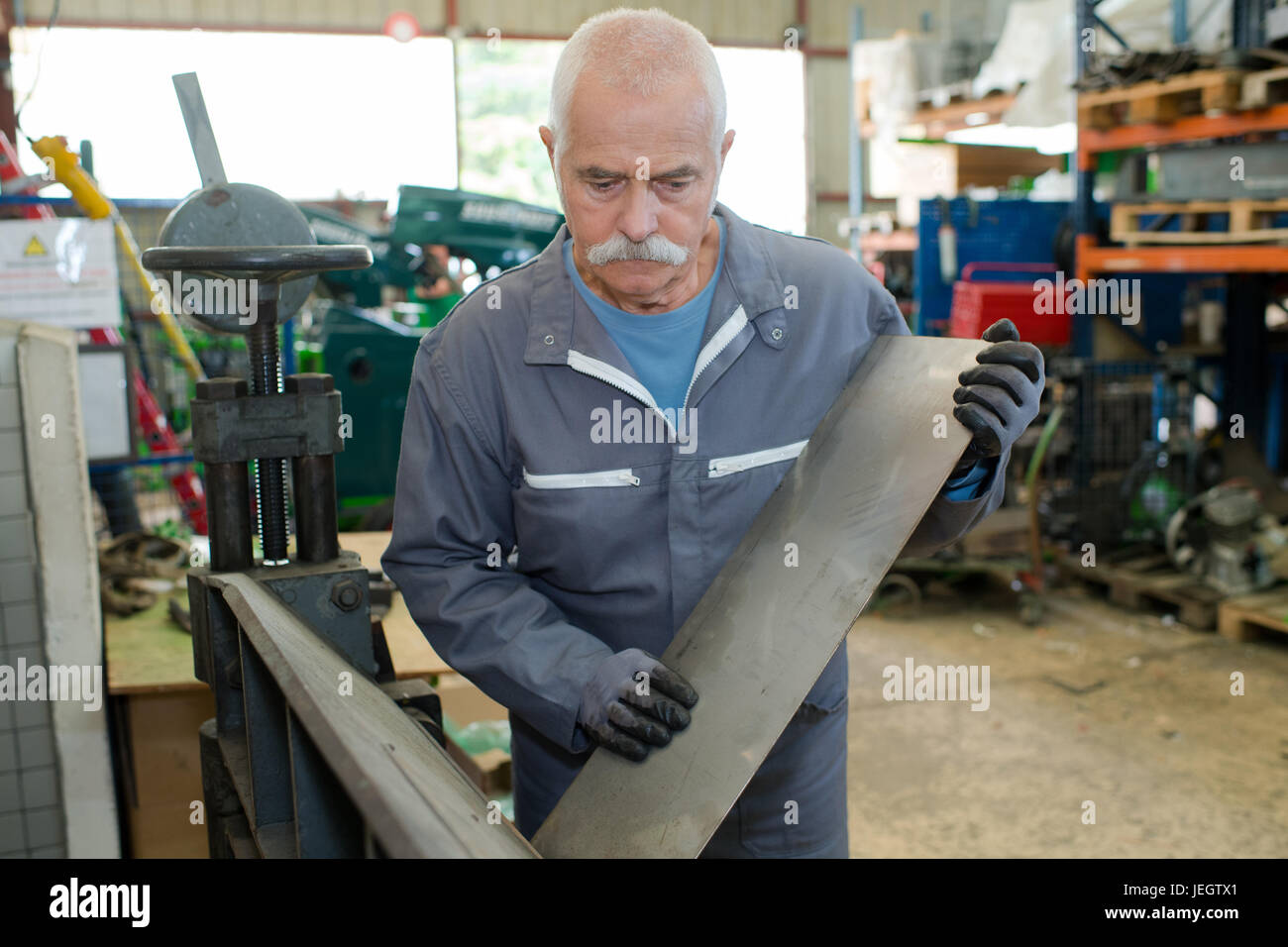mechanic using industrial lathe machine Stock Photo - Alamy