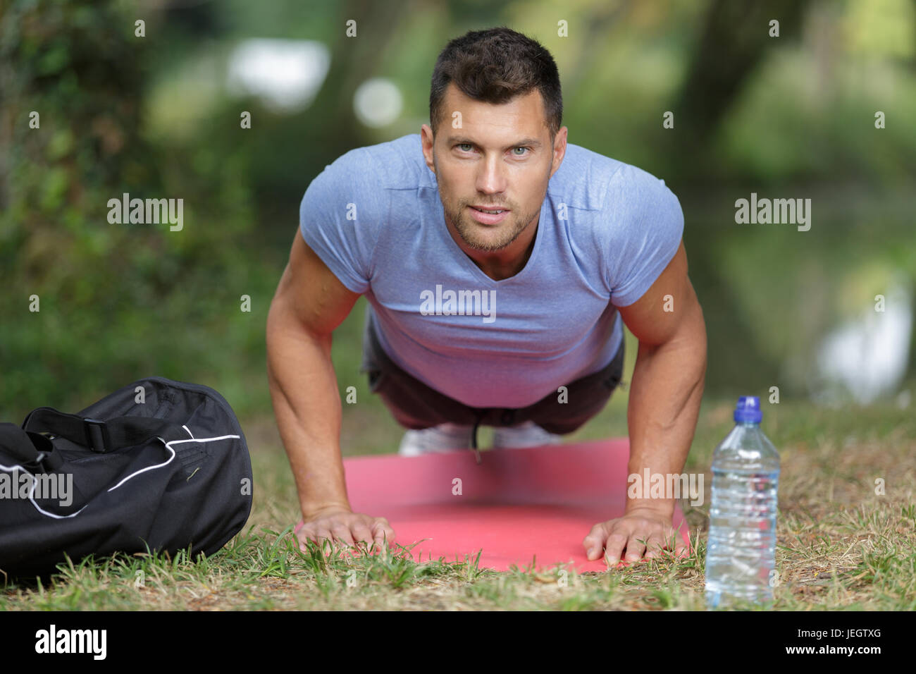 man making push-ups outdoors Stock Photo - Alamy