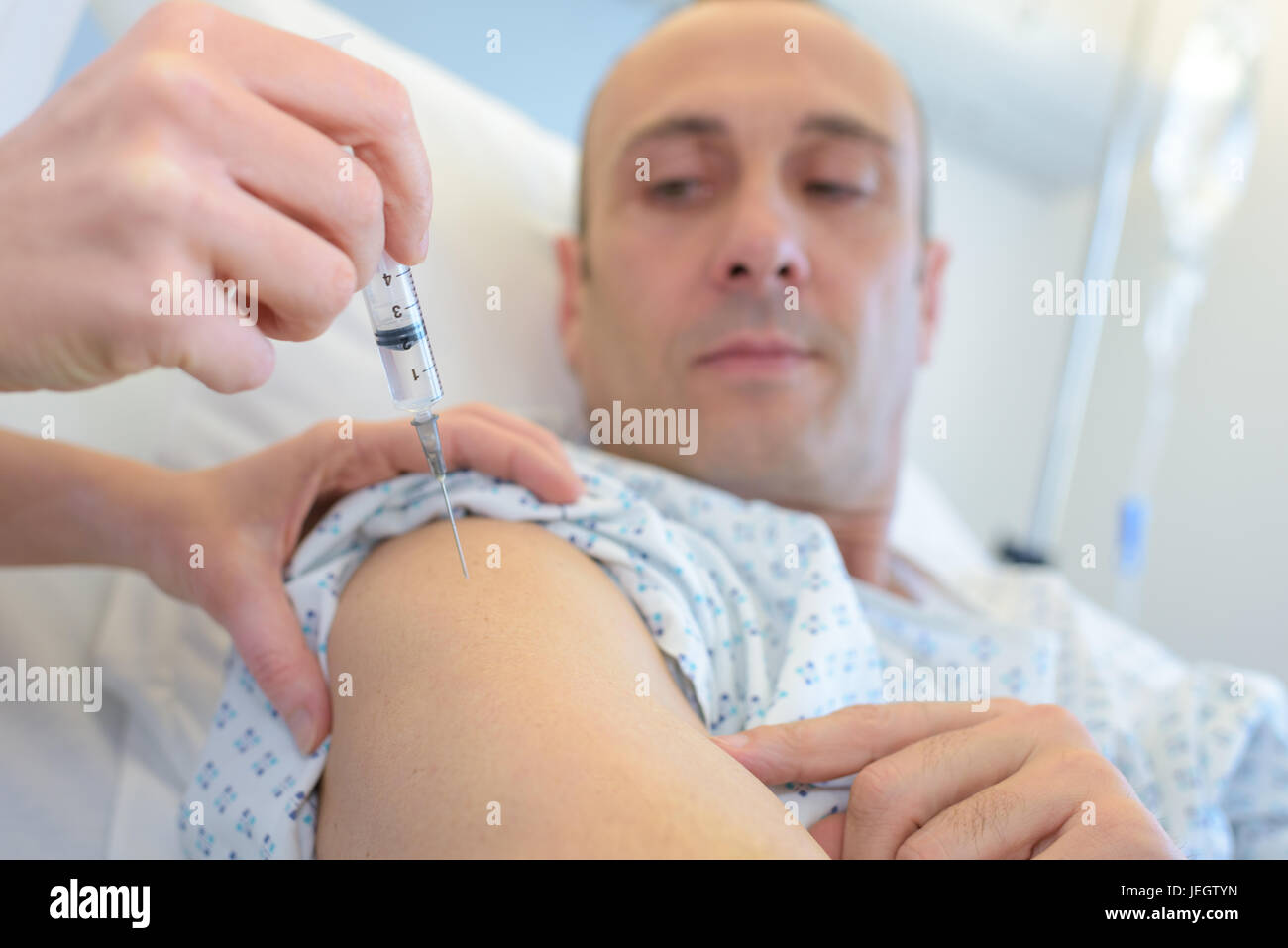 male get injection on his arm before blood donation Stock Photo - Alamy