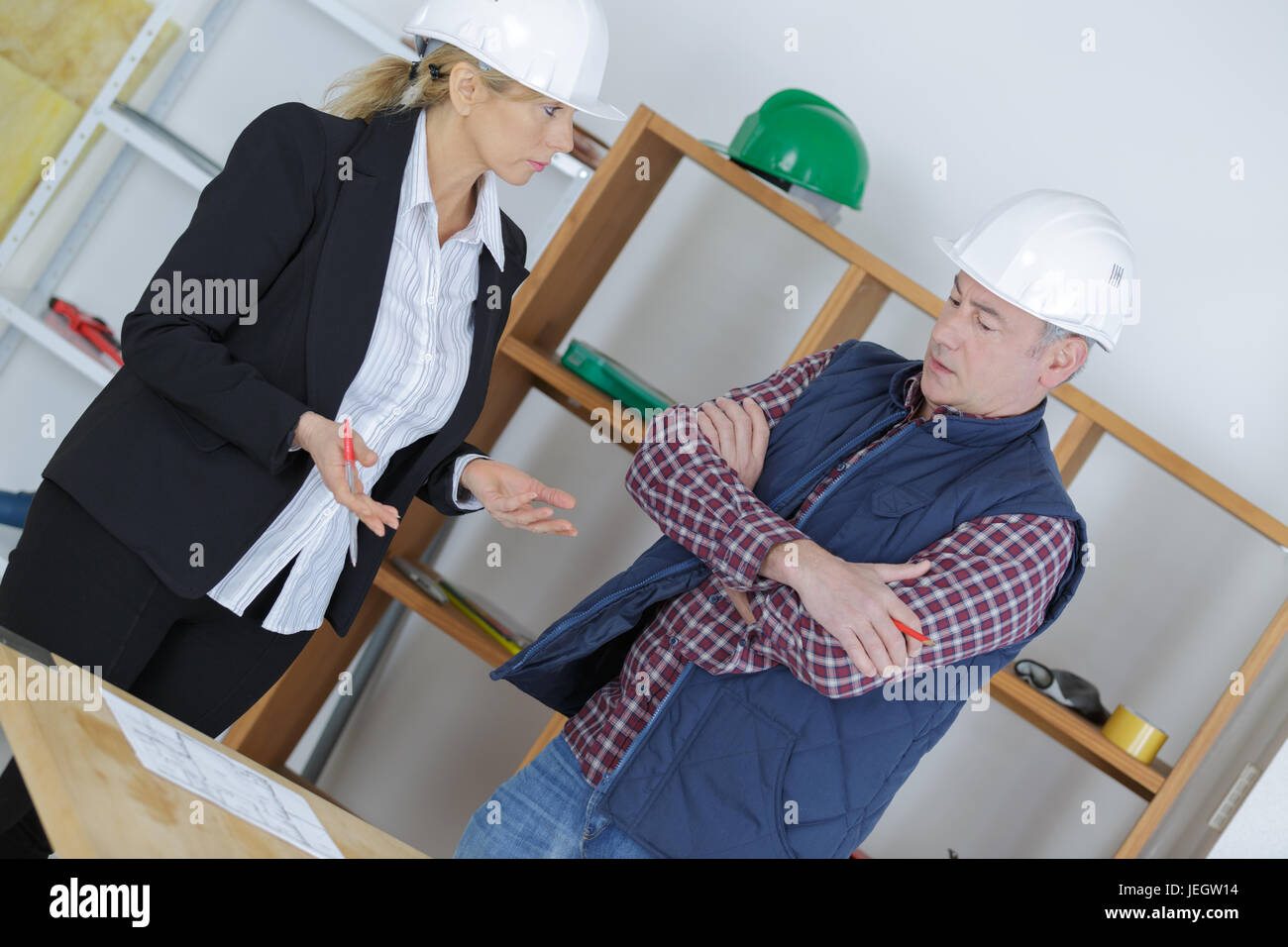Woman employee tablet plans hi-res stock photography and images - Alamy