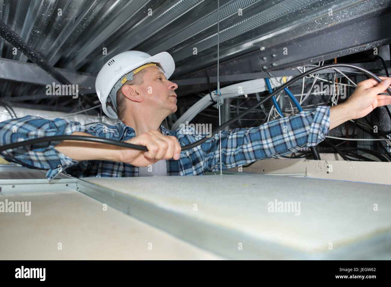 working on lighting Stock Photo - Alamy