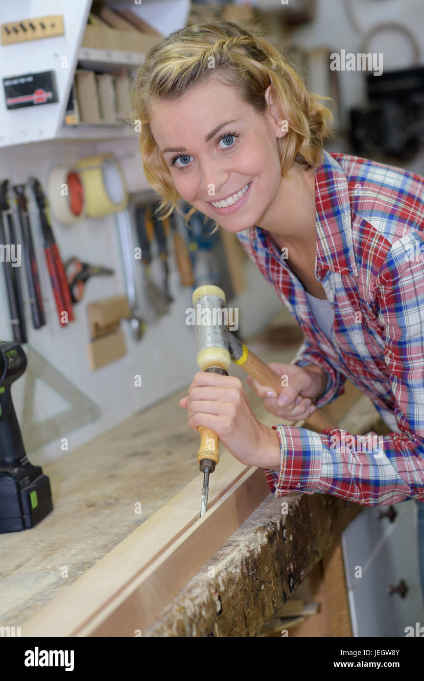 female carpenter with chisel in the hands Stock Photo - Alamy