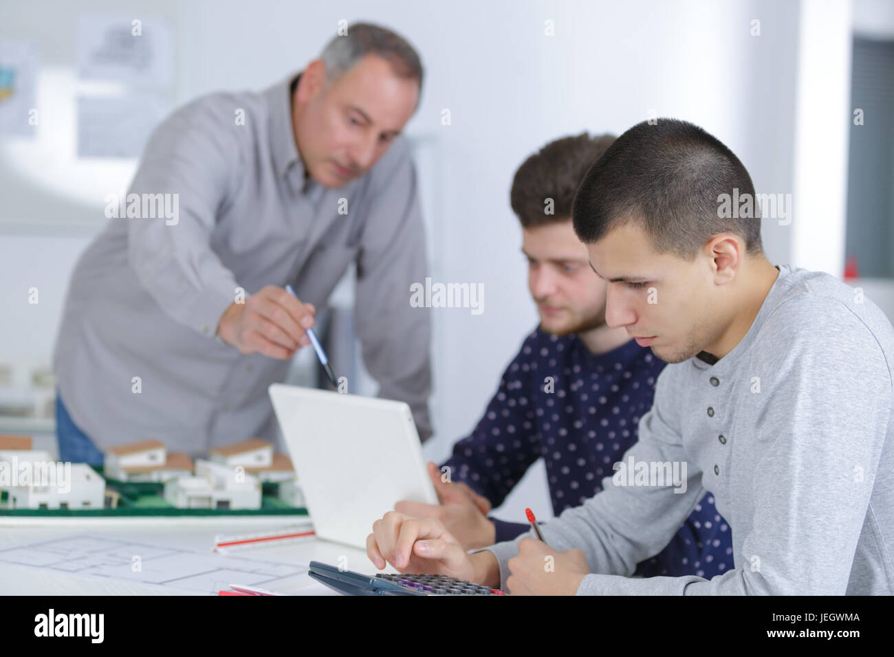 group of students working on construction project Stock Photo - Alamy