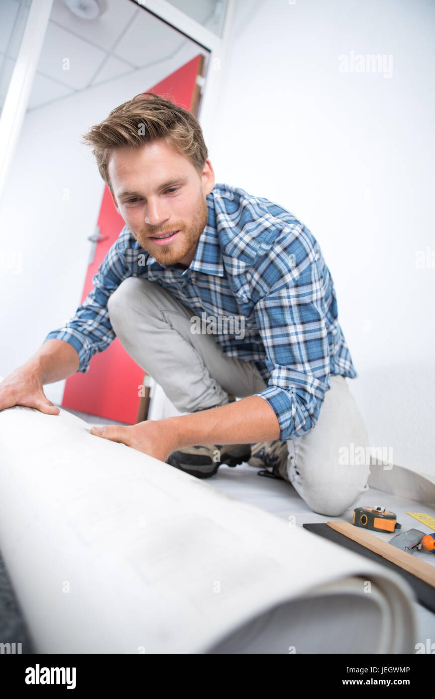 young man laying carpet Stock Photo - Alamy