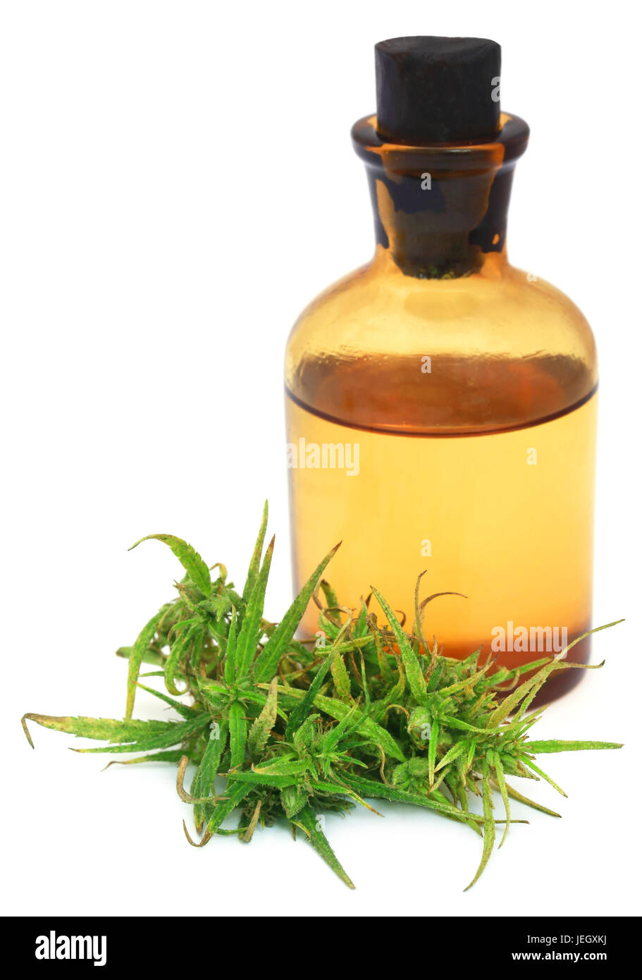 Cannabis extract with leaves over white background Stock Photo - Alamy