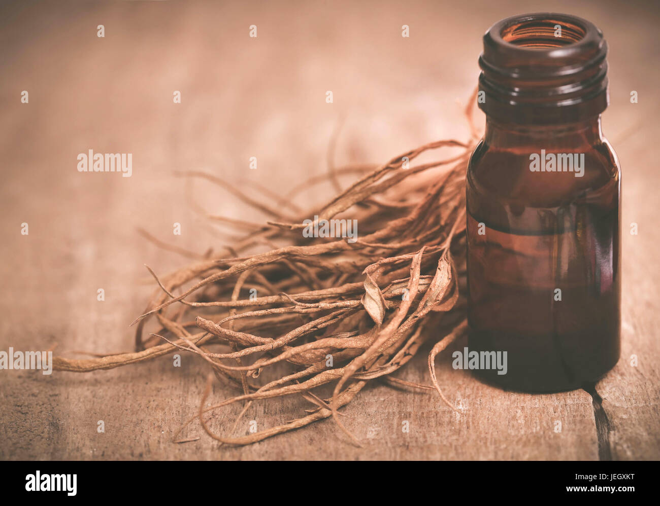 Cannabis extract with dry leaves on wooden surface Stock Photo - Alamy