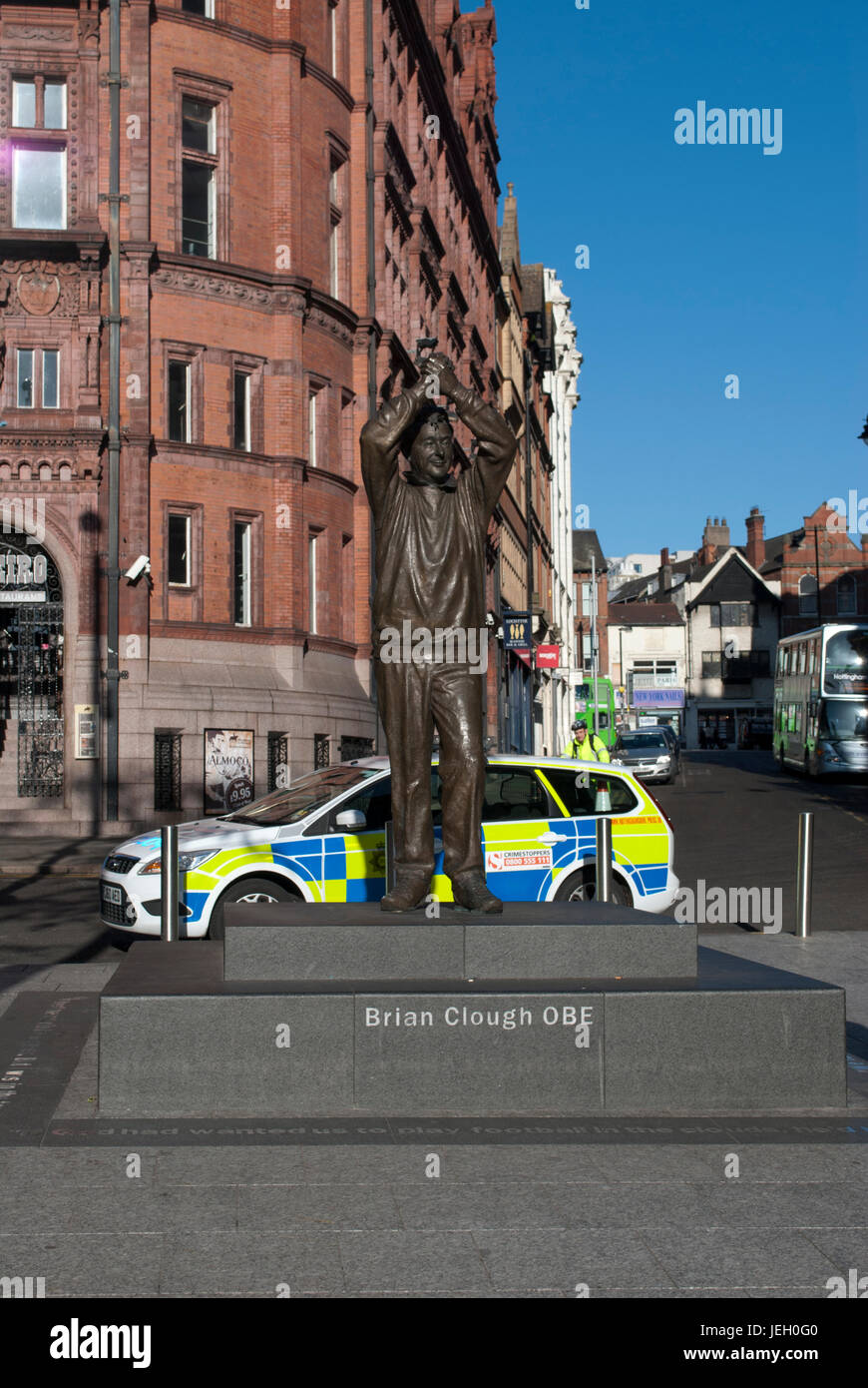 Brian Clough statue in Nottingham with police car behind Stock Photo ...
