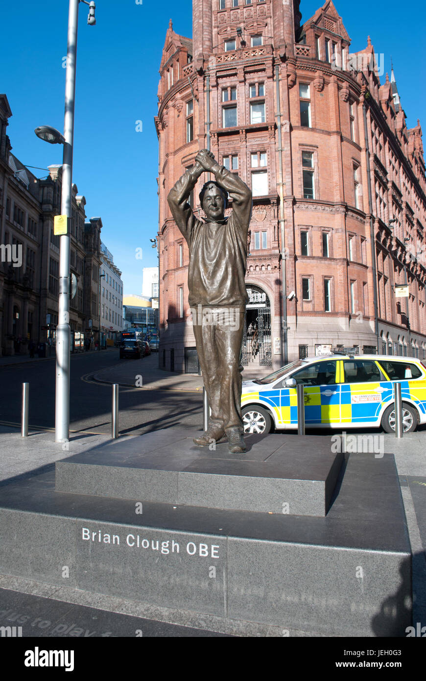 Brian Clough statue in Nottingham with police car behind Stock Photo ...