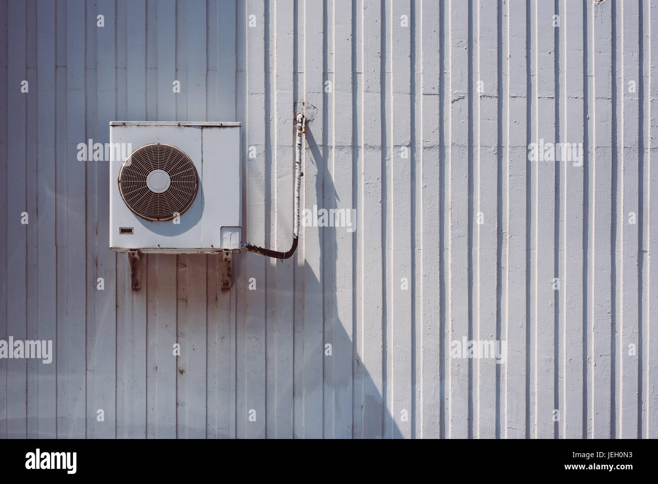 External air conditioner unit on white wall as copy space Stock Photo ...