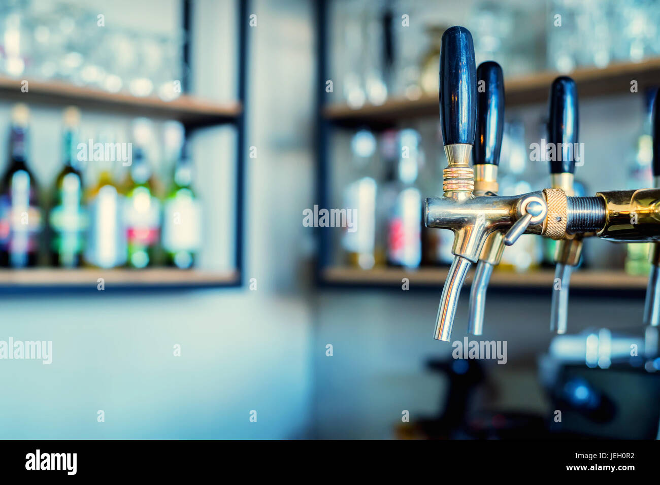 Chrome beer taps in modern bar Stock Photo - Alamy
