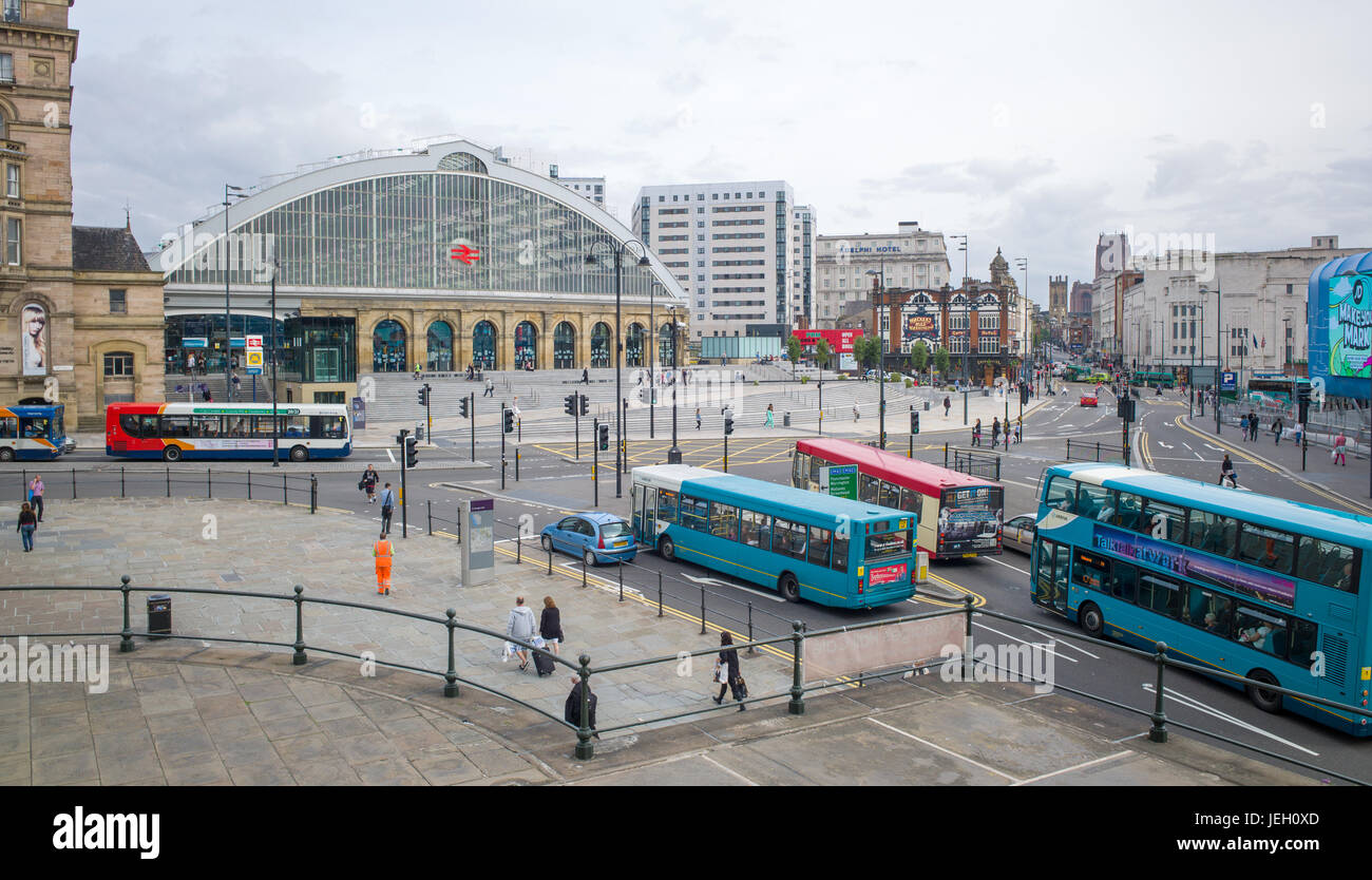 Three buses and two cars in St George's Place turning into Lime Street ...