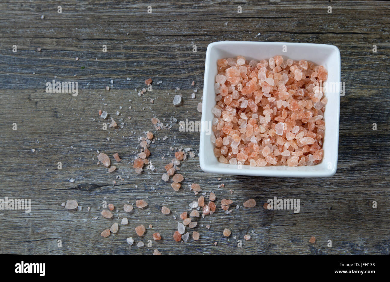 Bowl of Pink Himalayan Salt on w rustic wood plank board with room for ...