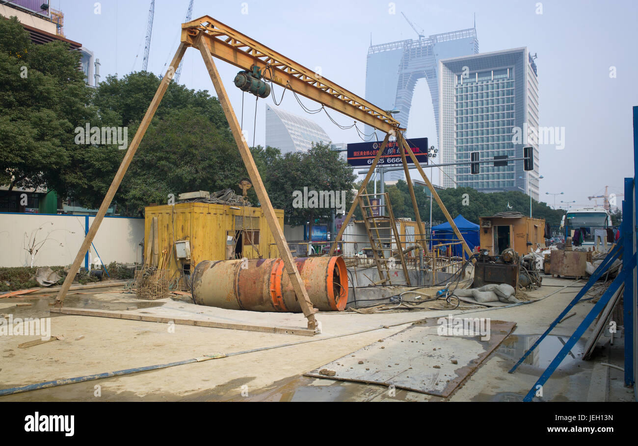 Gantry, tunnel borer, and electric hoist above excavation in Su Hui ...