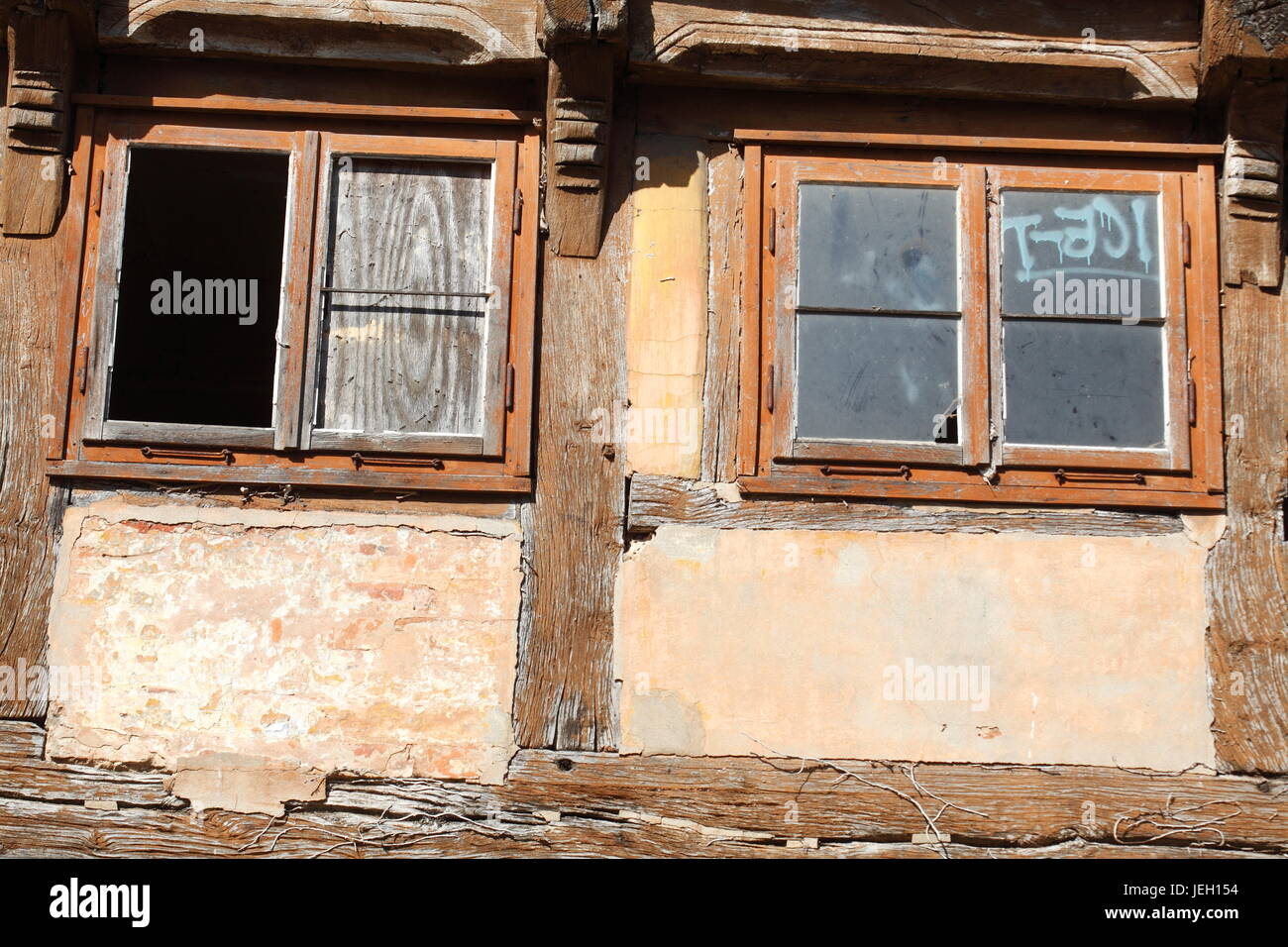 old windows on an old condemned wooden house Stock Photo - Alamy
