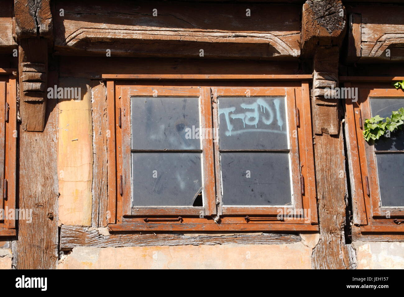 old windows on an old condemned wooden house Stock Photo - Alamy