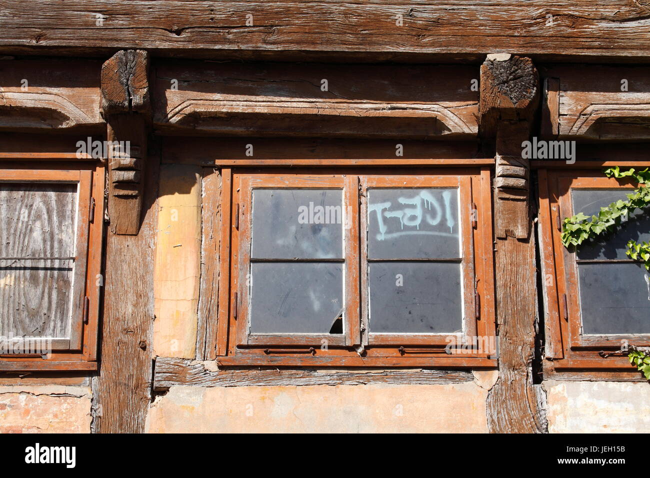 old windows on an old condemned wooden house Stock Photo - Alamy