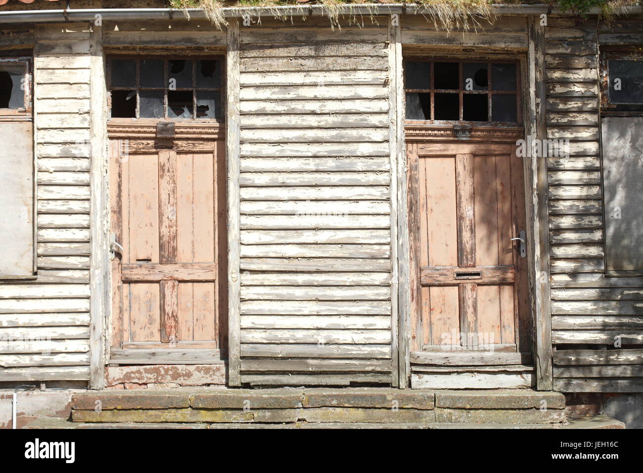 old doors on an old condemned wooden house Stock Photo - Alamy