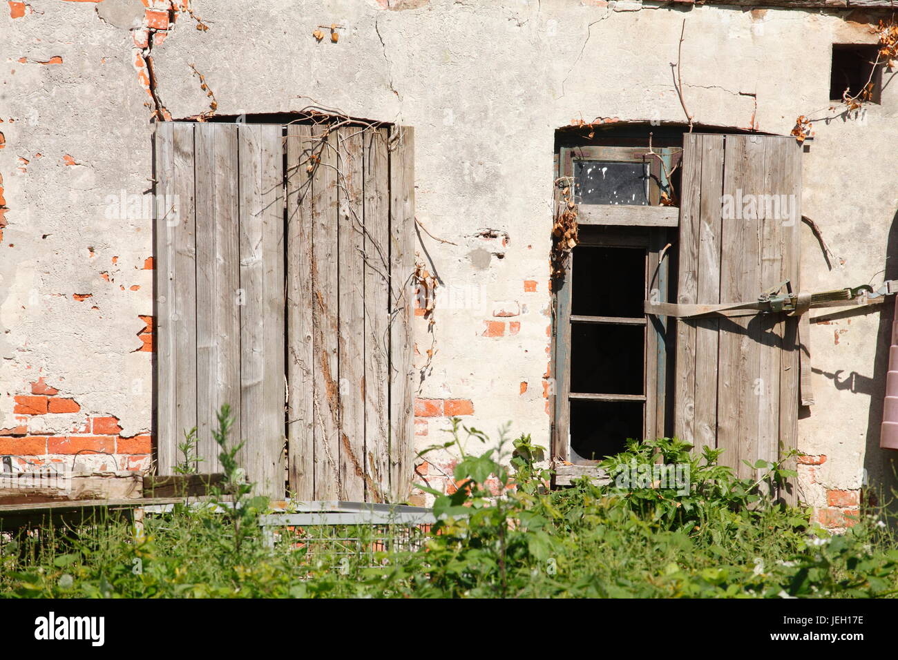 old doors on an old condemned wooden house Stock Photo - Alamy