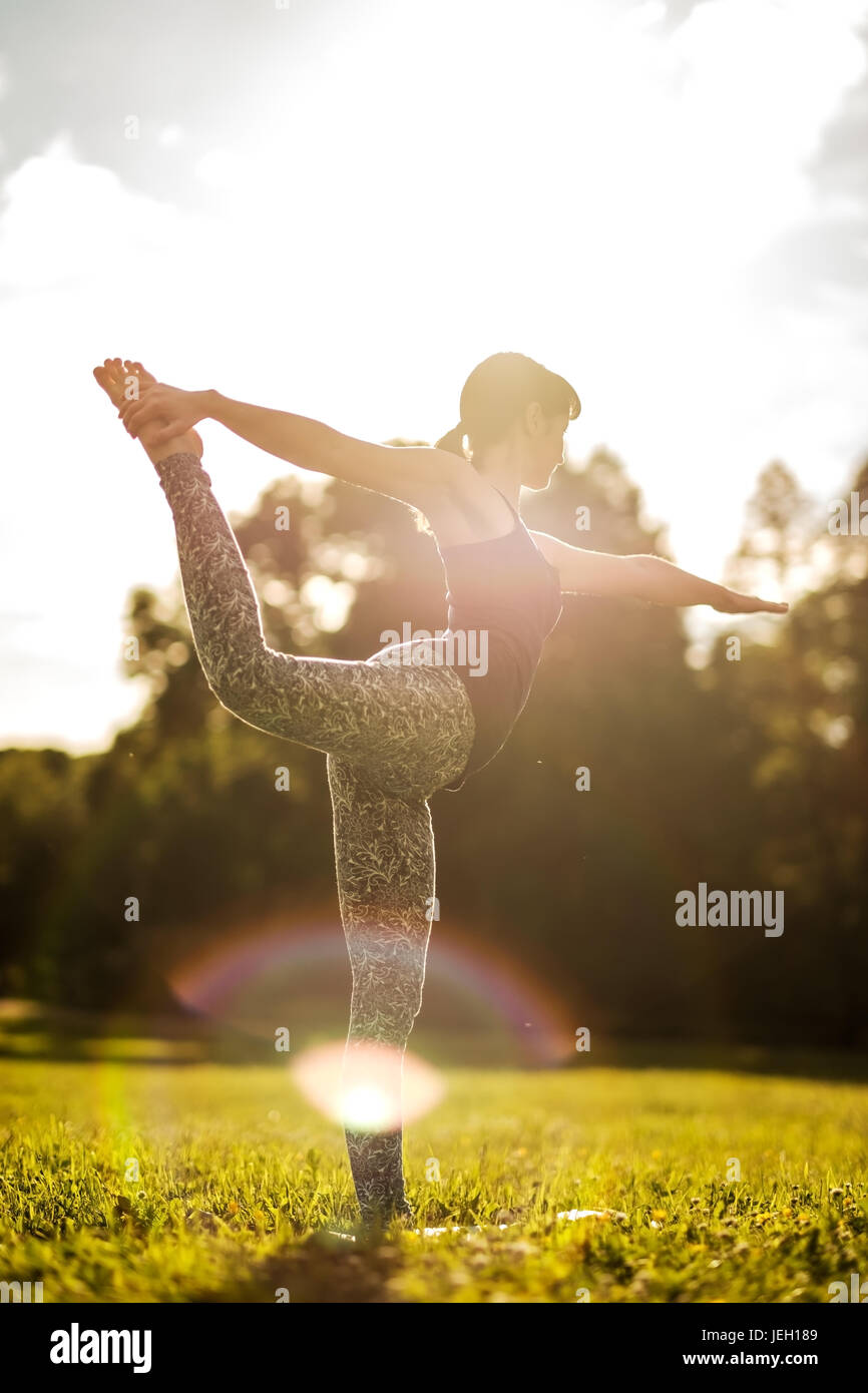 Caucasian woman in yoga standing balance Natarajasana. Back view Stock ...