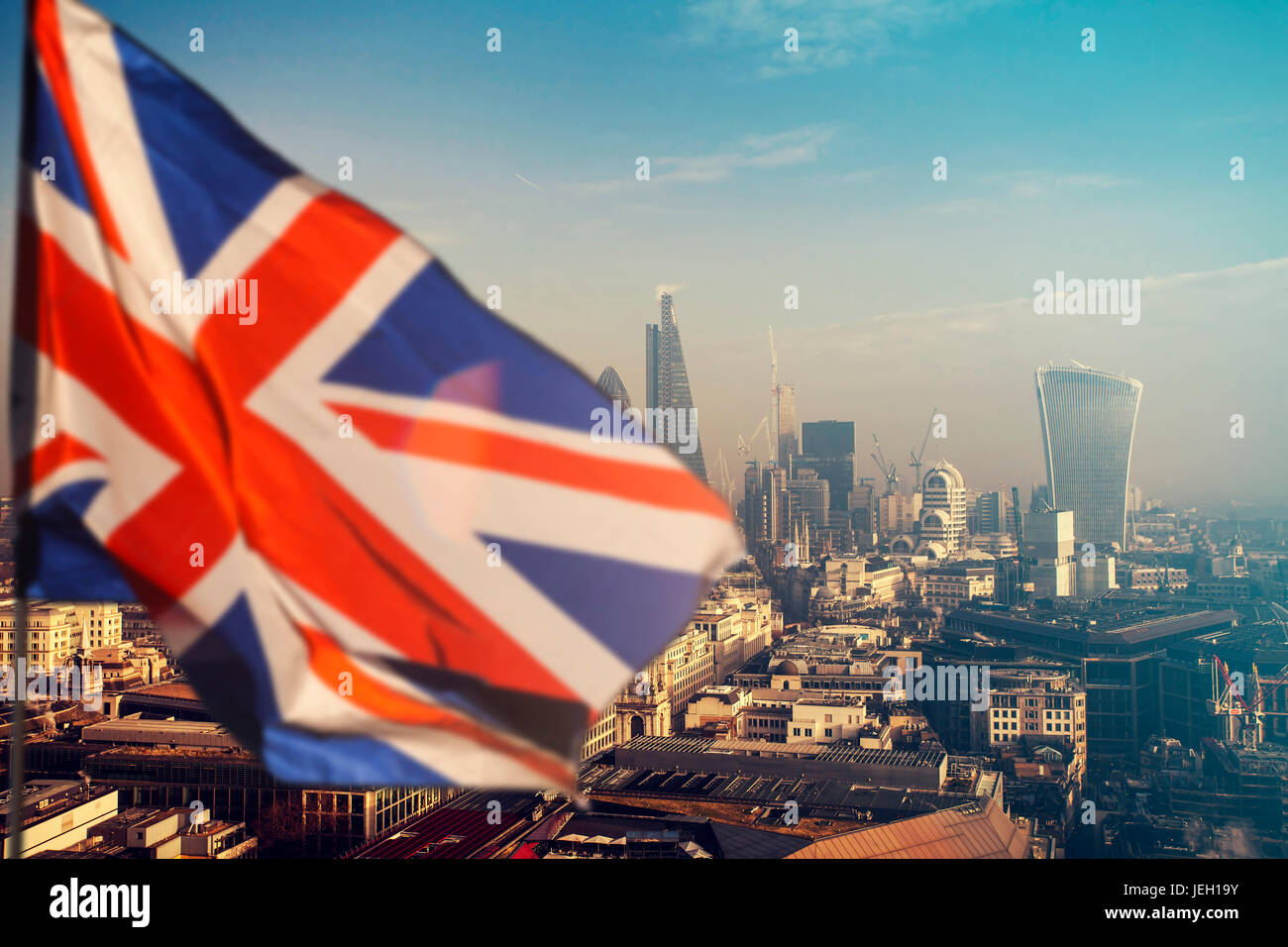 British Union Jack flag and aerial view of London with financial ...