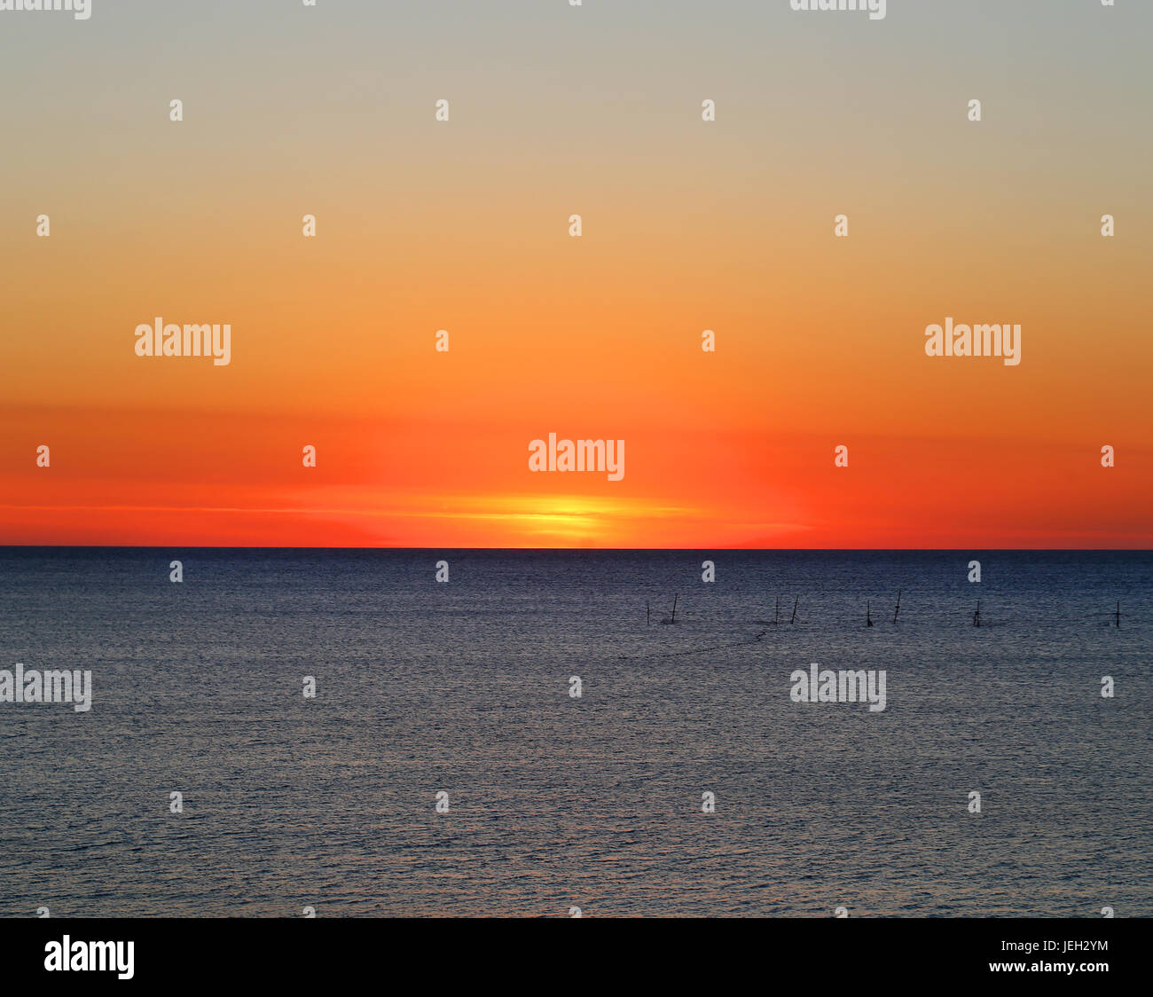 Photo of a bright sea sunset Stock Photo - Alamy