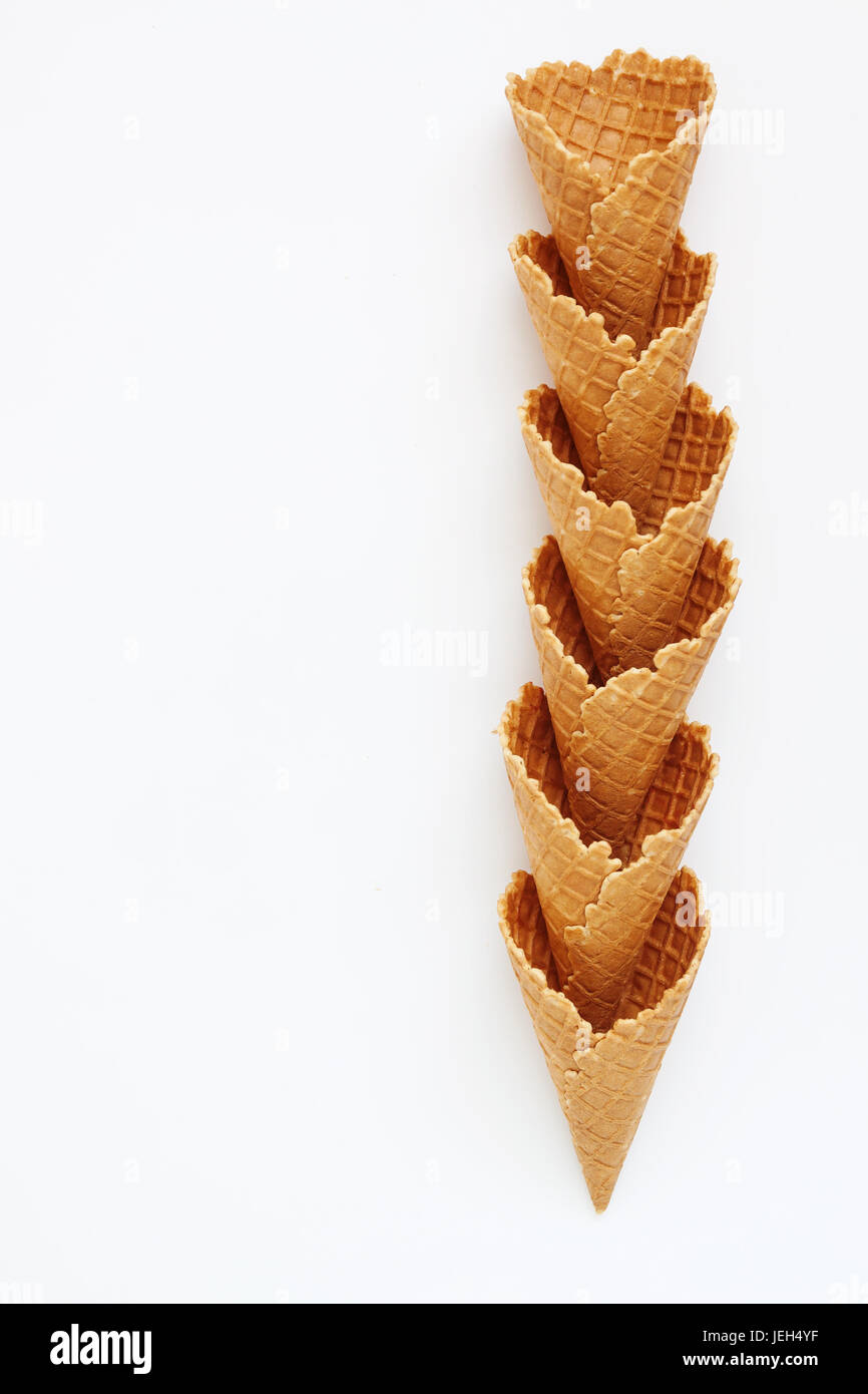 Several waffle cones lined in tower, smile, or even row, top view ...
