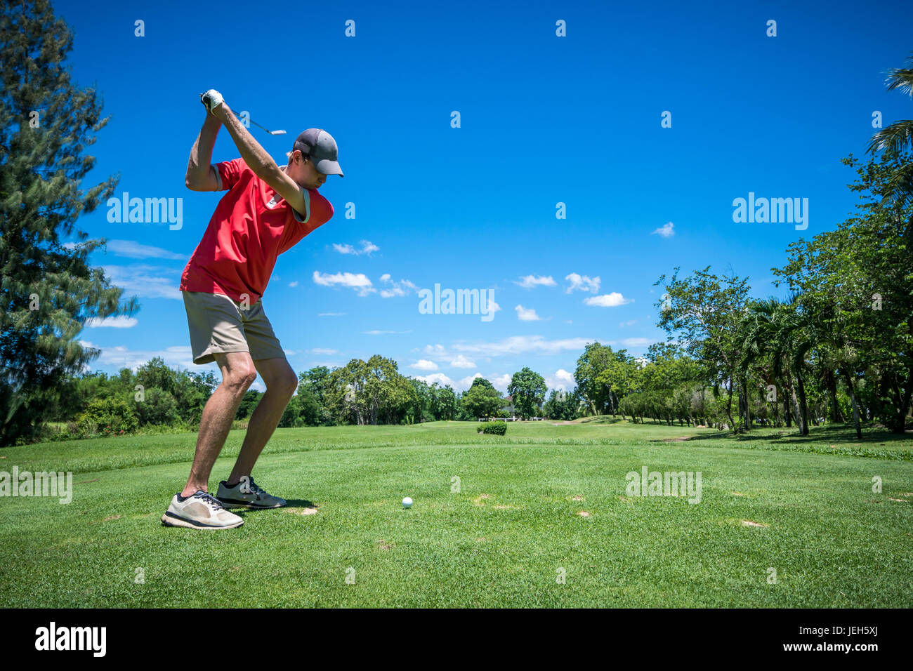 Golfer tee off hi-res stock photography and images - Alamy