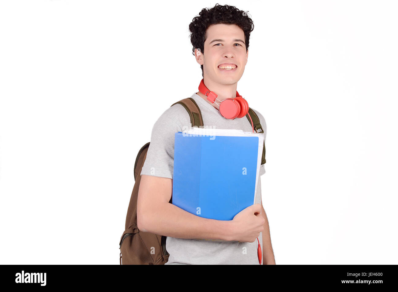 Portrait of young student holding notebook. Isolated white background ...