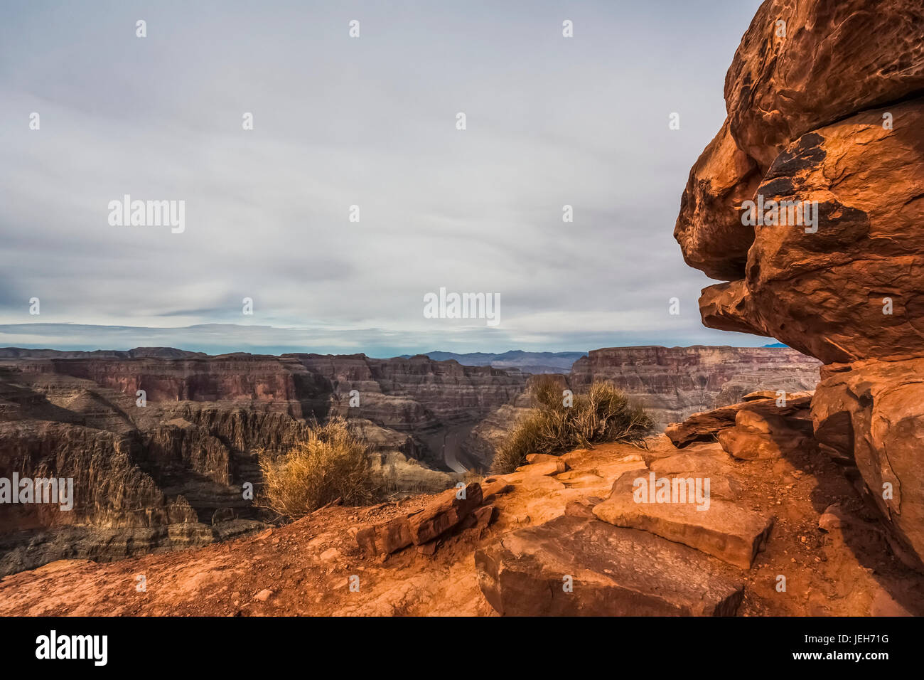 Rugged landscape with rock showing layers of sediment and erosion ...